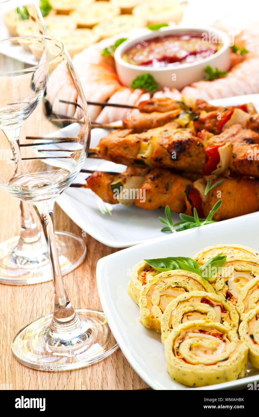Many dishes of bite size appetizers and party food Stock Photo - Alamy