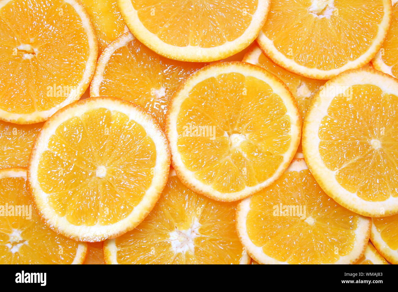 healthy orange fruit background with sliced oranges Stock Photo - Alamy