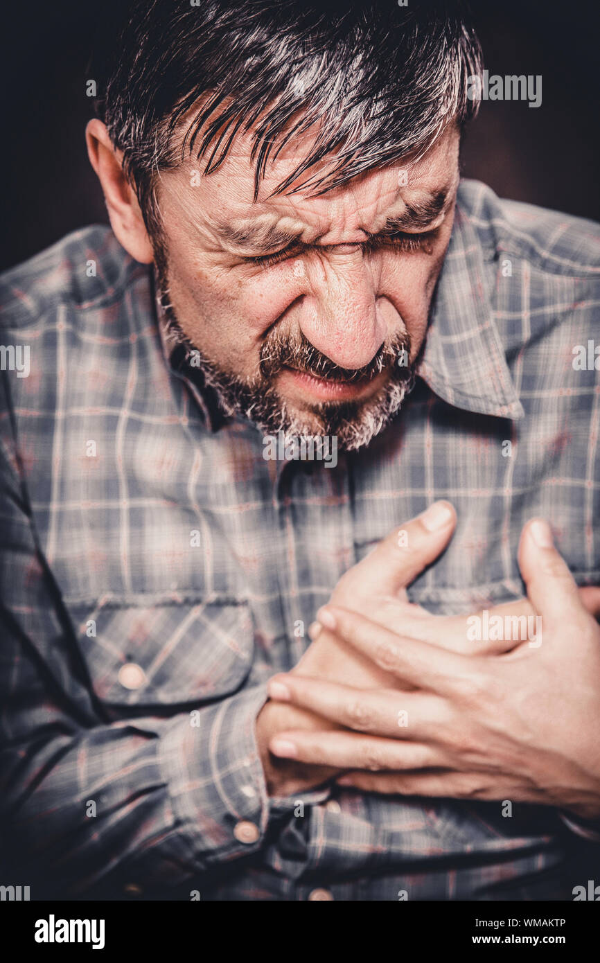 Man having chest pain Stock Photo - Alamy