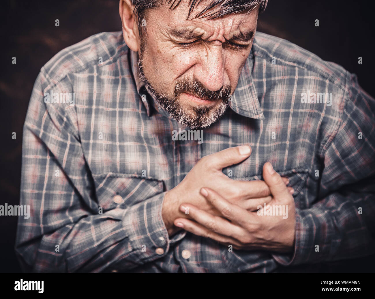 Man having chest pain Stock Photo - Alamy