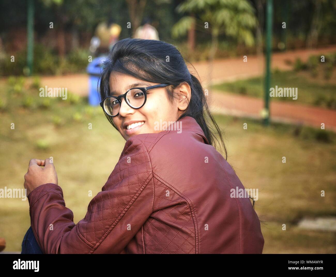 Girl In Leather Jacket Sitting High Resolution Stock Photography and ...