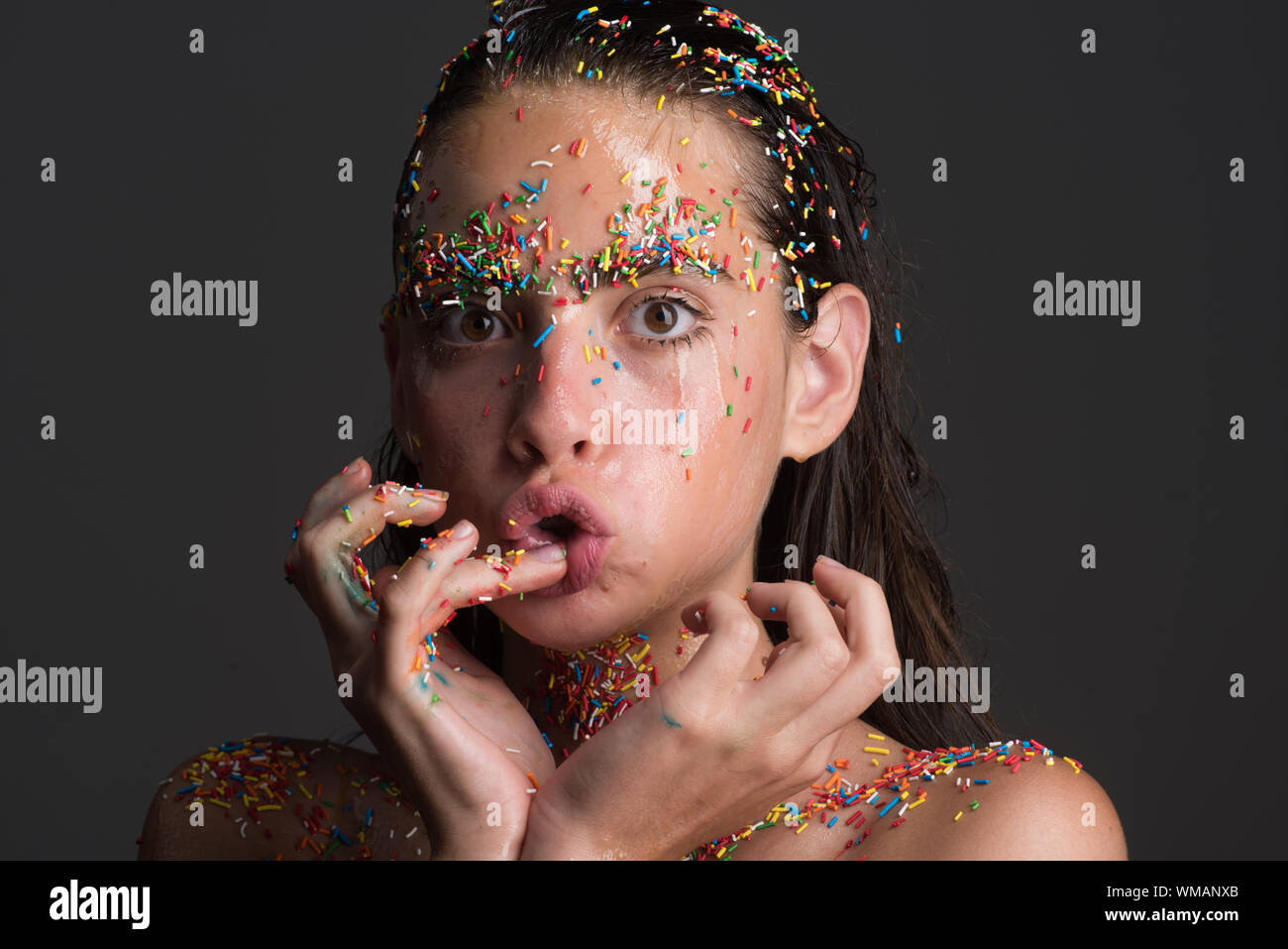 Young woman with sprinkles makeup. woman in fashionable glasses with ...