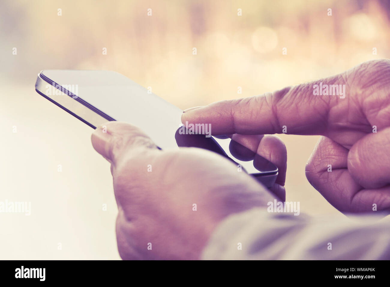 Man texting on his smartphone Stock Photo - Alamy