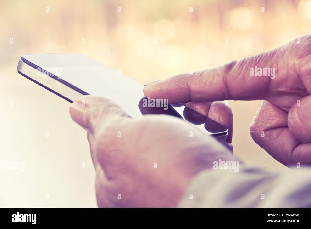 Man texting on his smartphone Stock Photo - Alamy