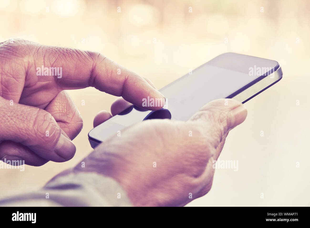 Man texting on his smartphone Stock Photo - Alamy