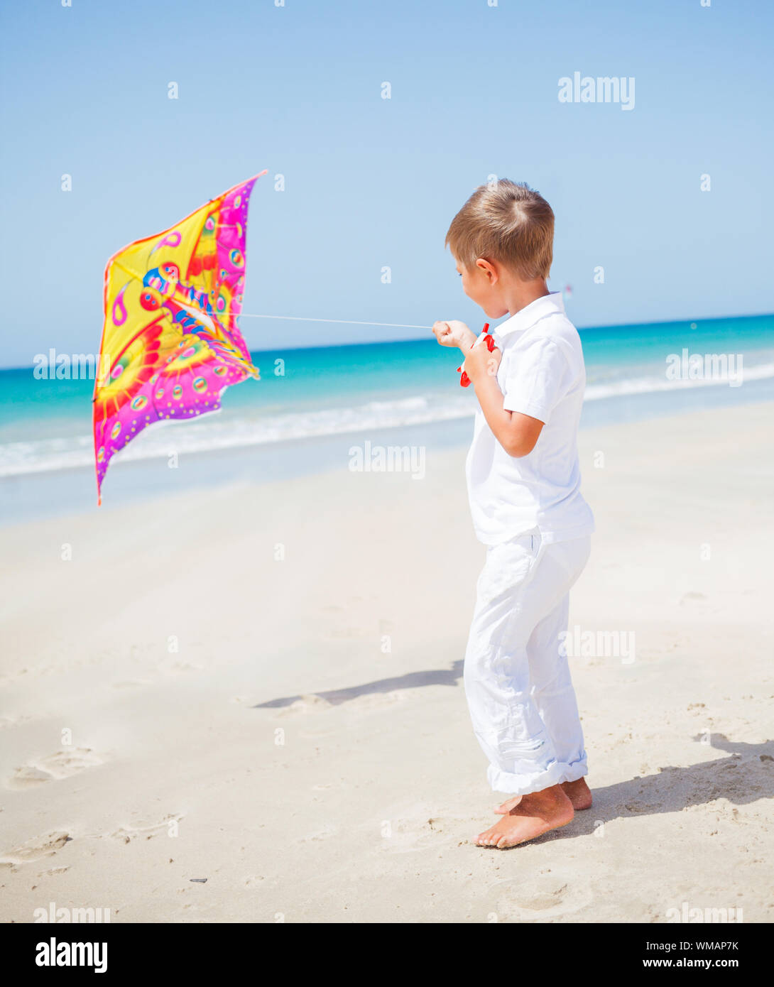 Blond boy flying kite hi-res stock photography and images - Alamy