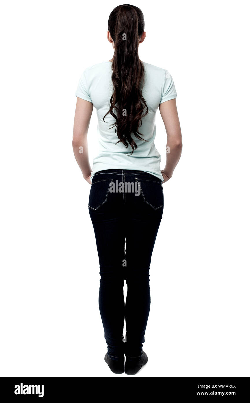 Full length of young woman facing the wall Stock Photo - Alamy