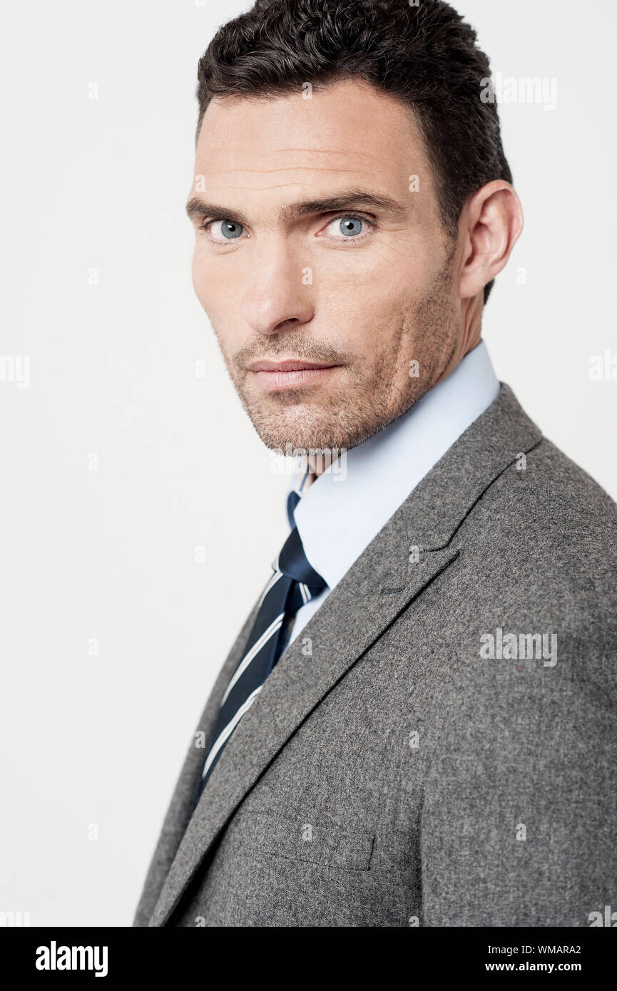 Side pose of businessman posing over white Stock Photo - Alamy