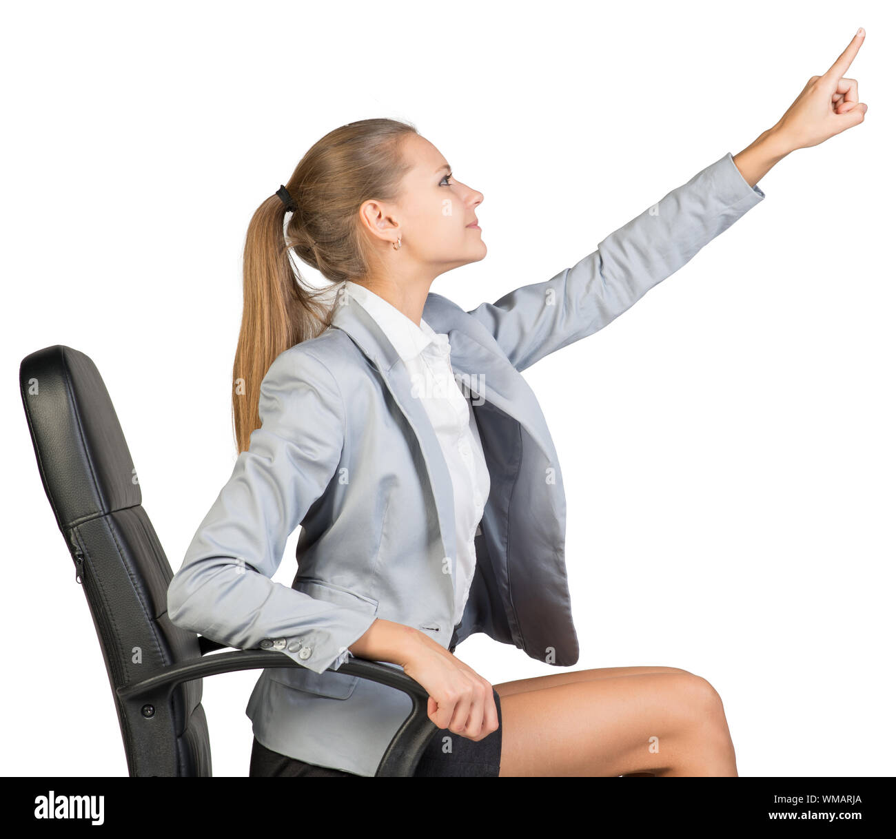 Businesswoman on office chair, pointing finger up and ahead. Isolated ...