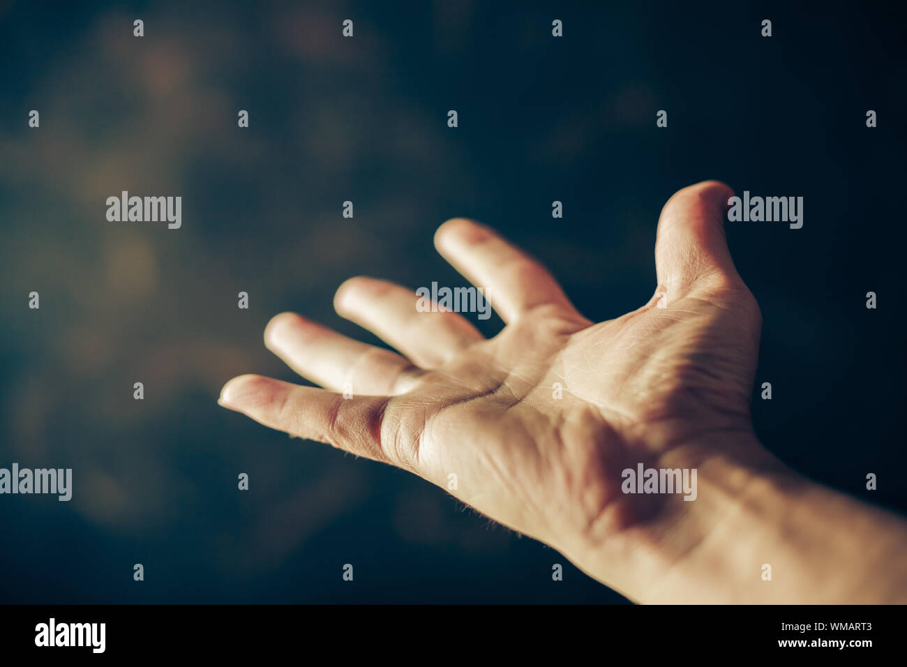 hands begging on a brown background Stock Photo - Alamy