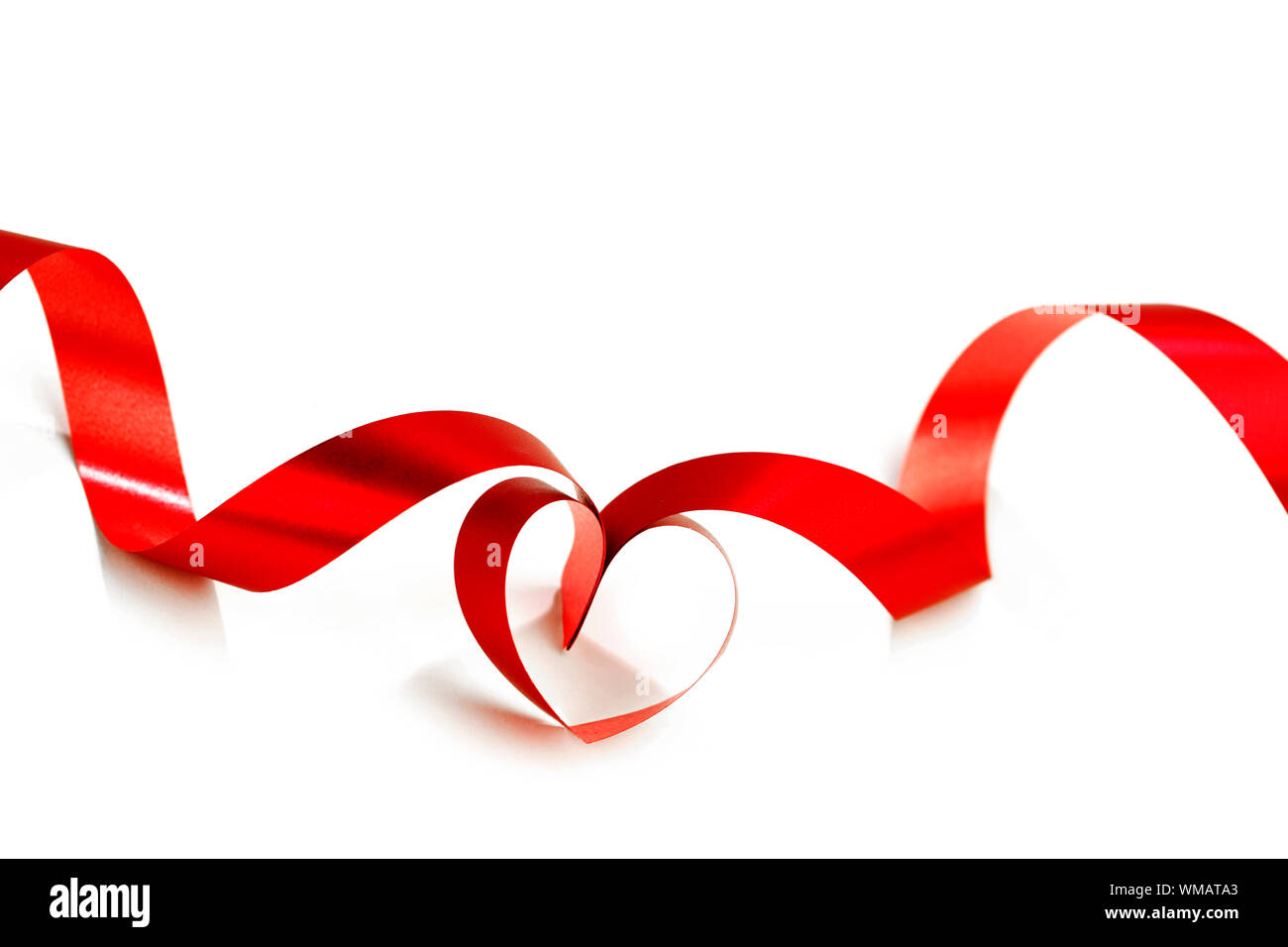 Heart from red ribbon isolated on white background Stock Photo - Alamy