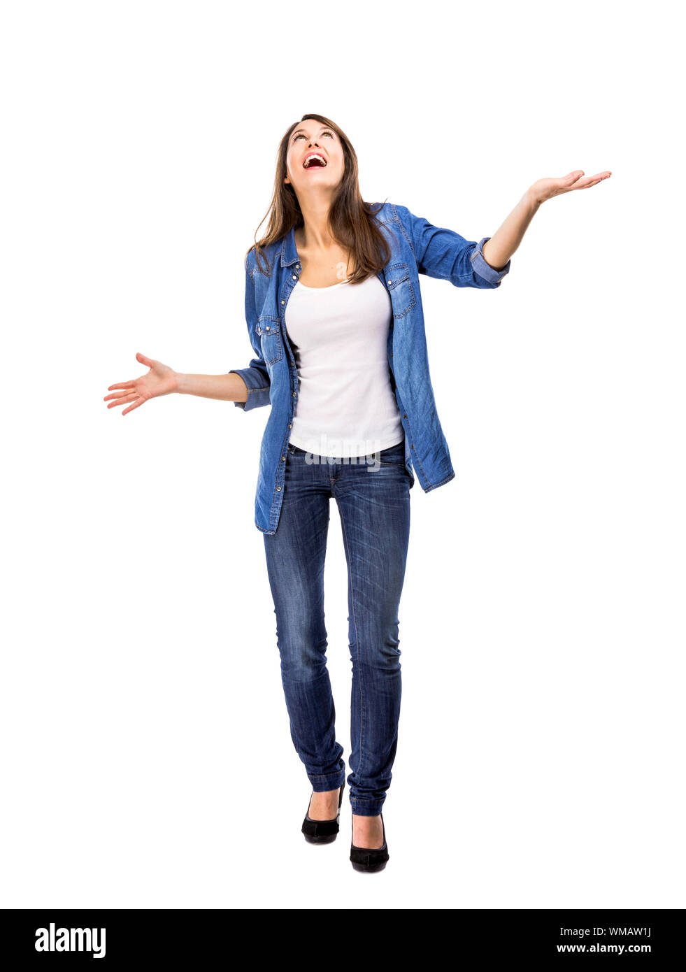 Happy woman trying to catch something falling from the sky Stock Photo ...