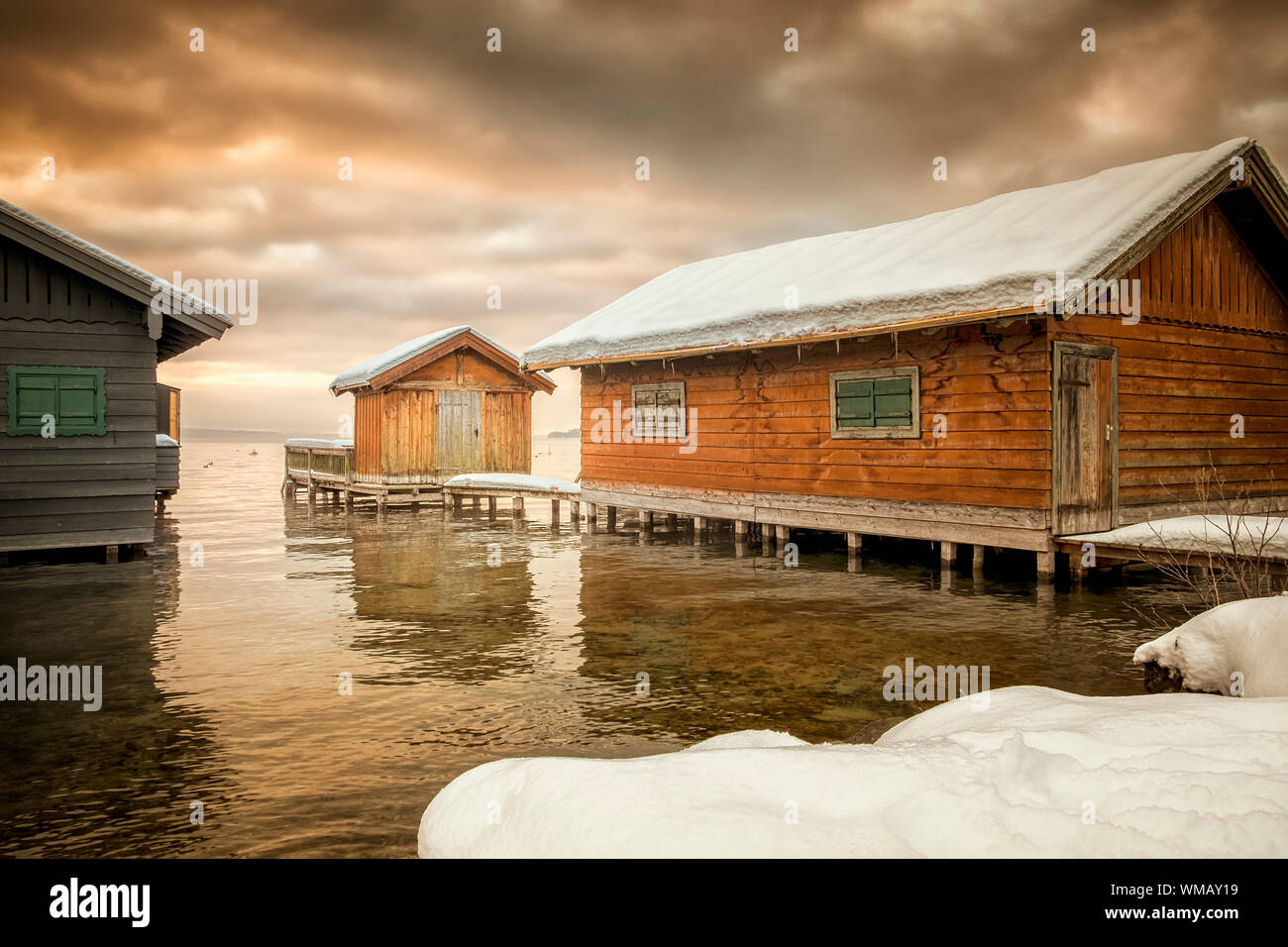 An image of the lake huts in Tutzing Bavaria Germany at winter sunrise ...