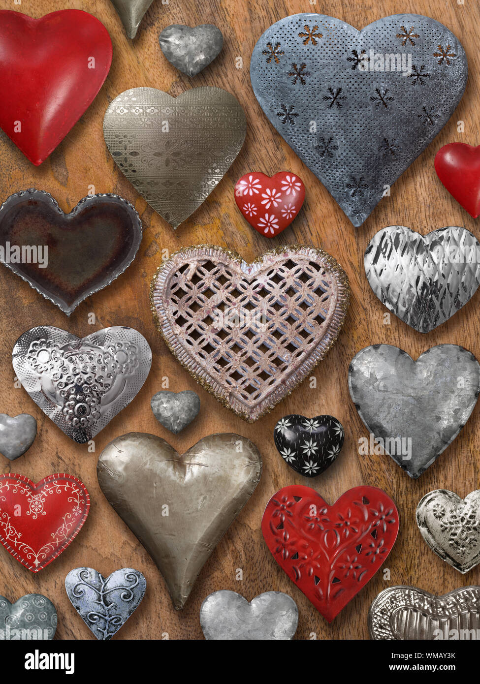 Photos of many heart-shaped things made of stone, metal and wood on ...
