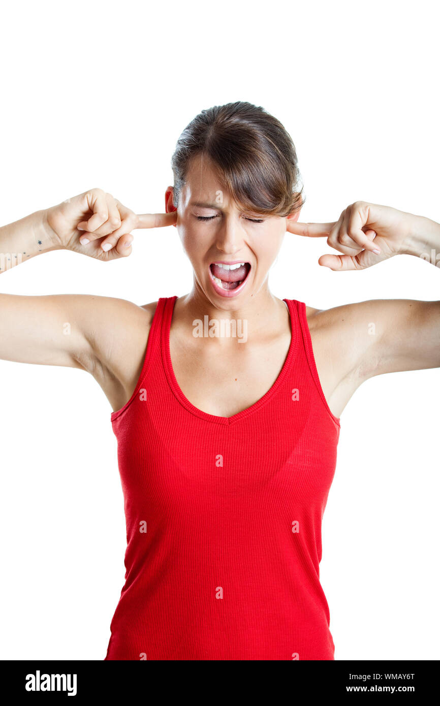 Portrait of disturbed young woman screaming while putting her finger on ...