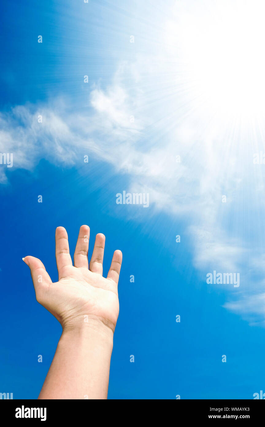 abstract concept hand towards sky, ray of light Stock Photo - Alamy