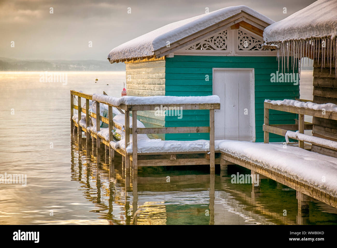 An image of the lake huts in Tutzing Bavaria Germany at winter sunrise ...