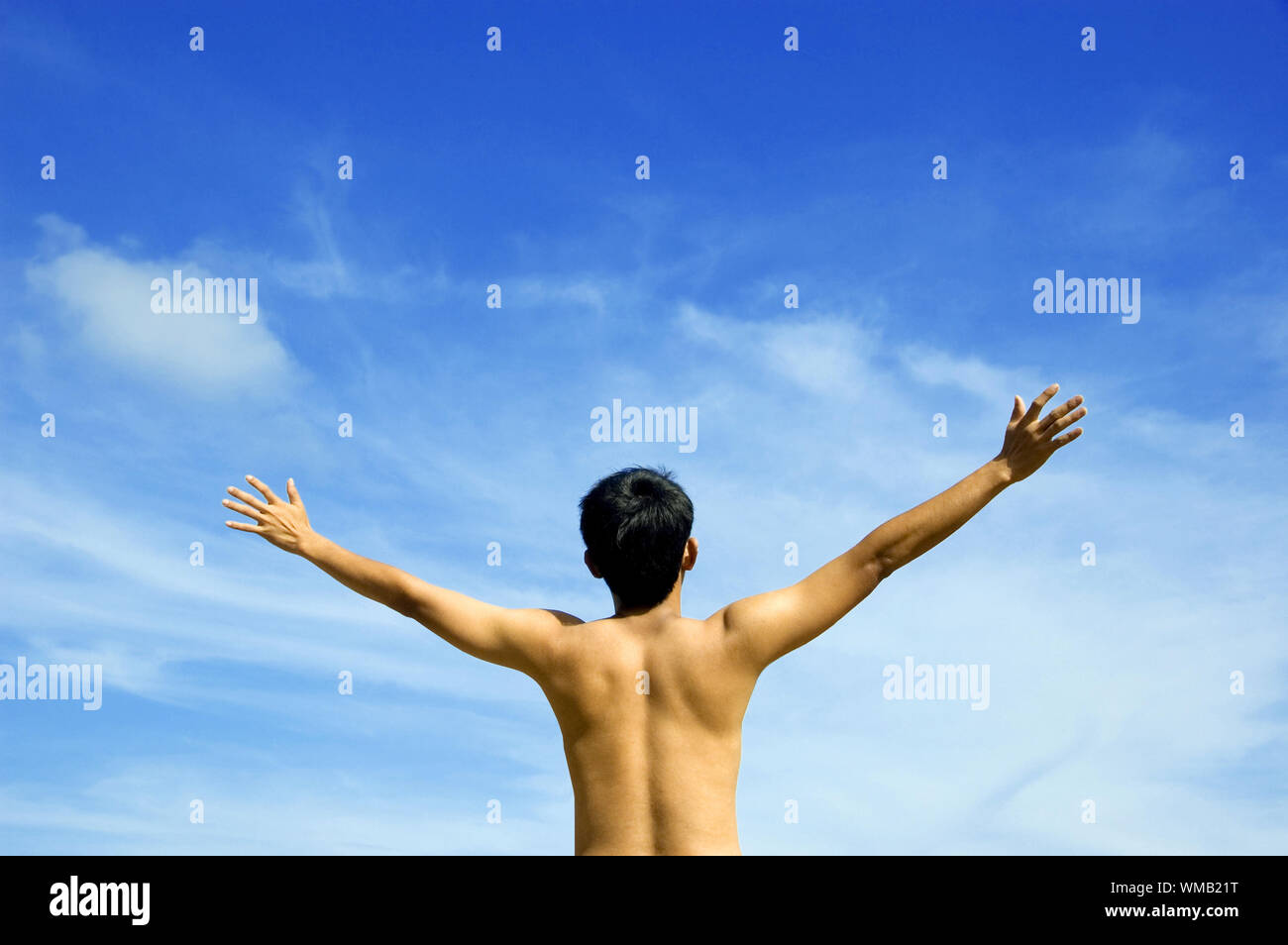 Man with his arms wide open Stock Photo - Alamy
