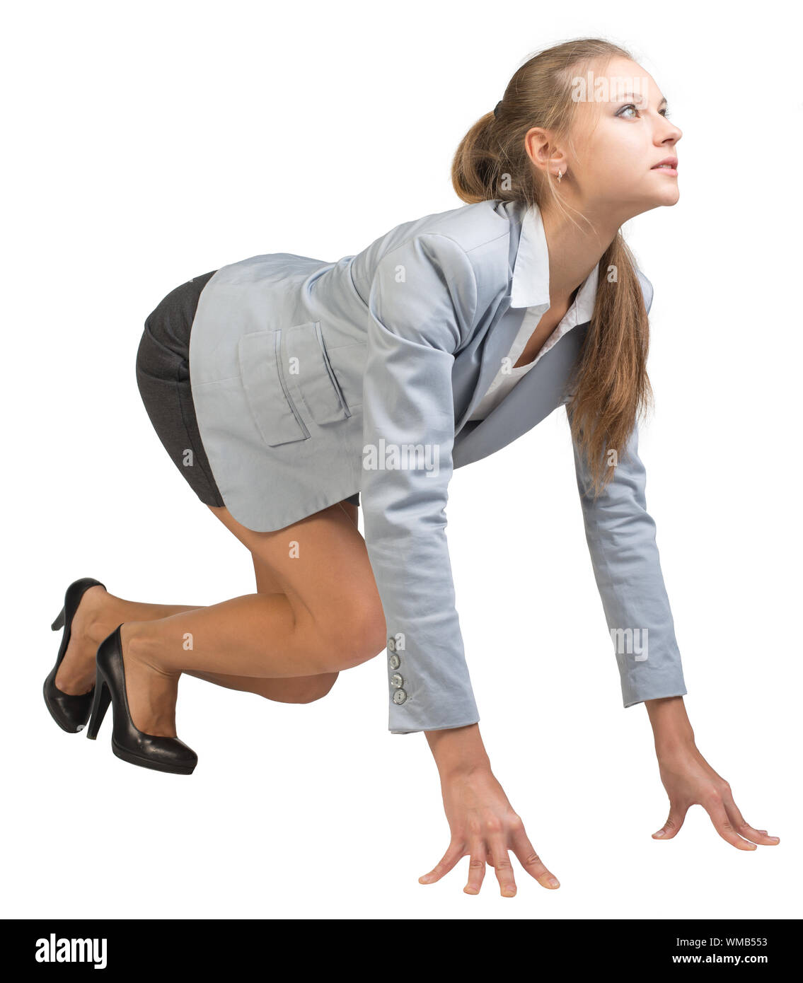 Businesswoman standing in running start pose, half-turn. Isolated over ...