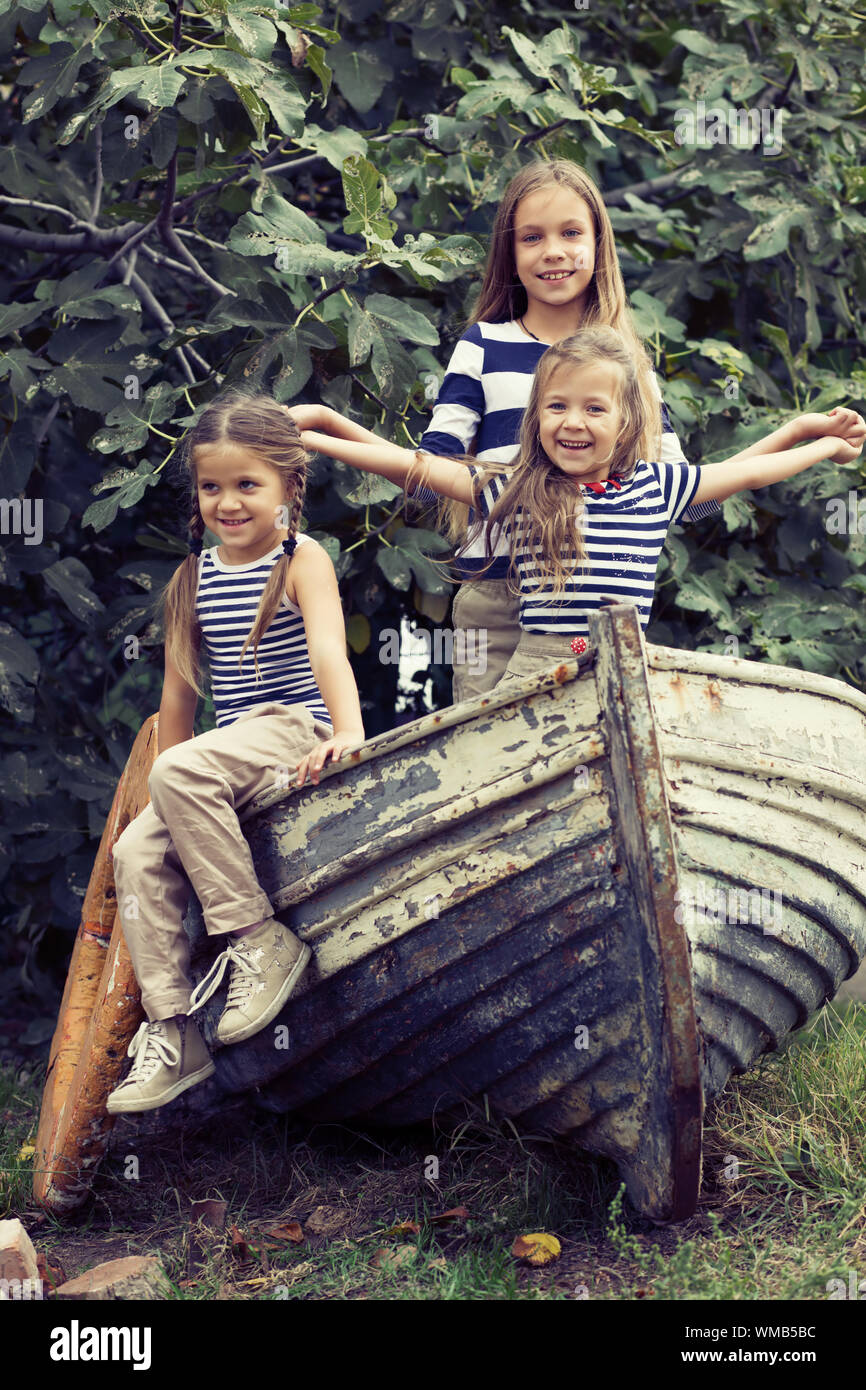 Children playing with sailing boat hi-res stock photography and images ...