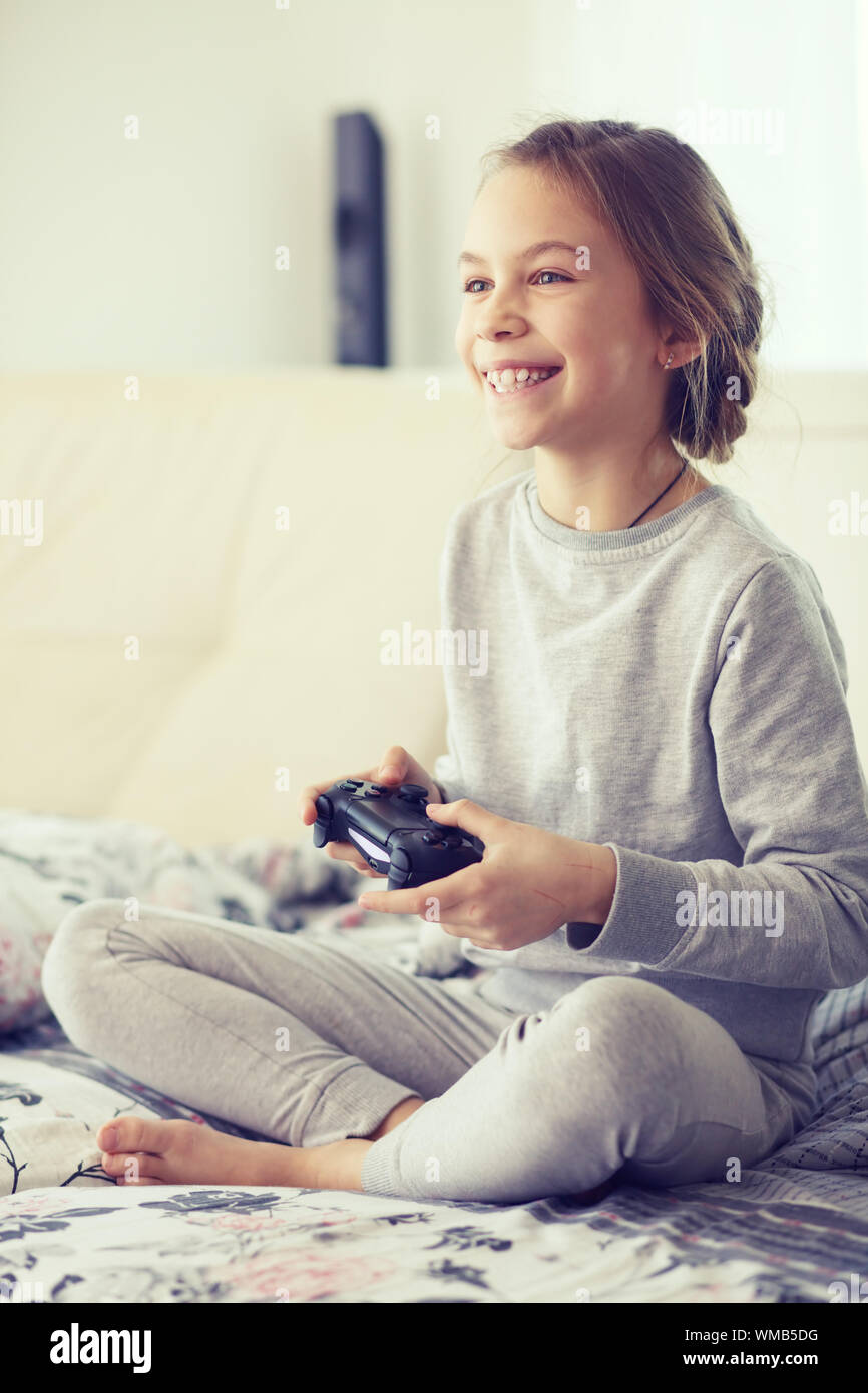 Child playing video game Stock Photo - Alamy