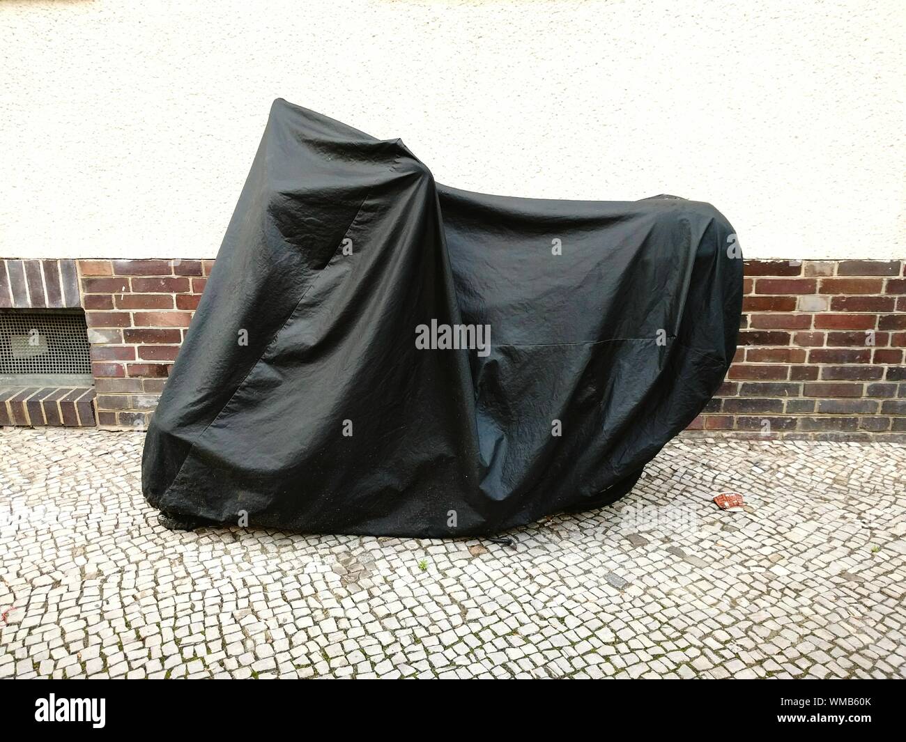 Covered motorcycle hi-res stock photography and images - Alamy