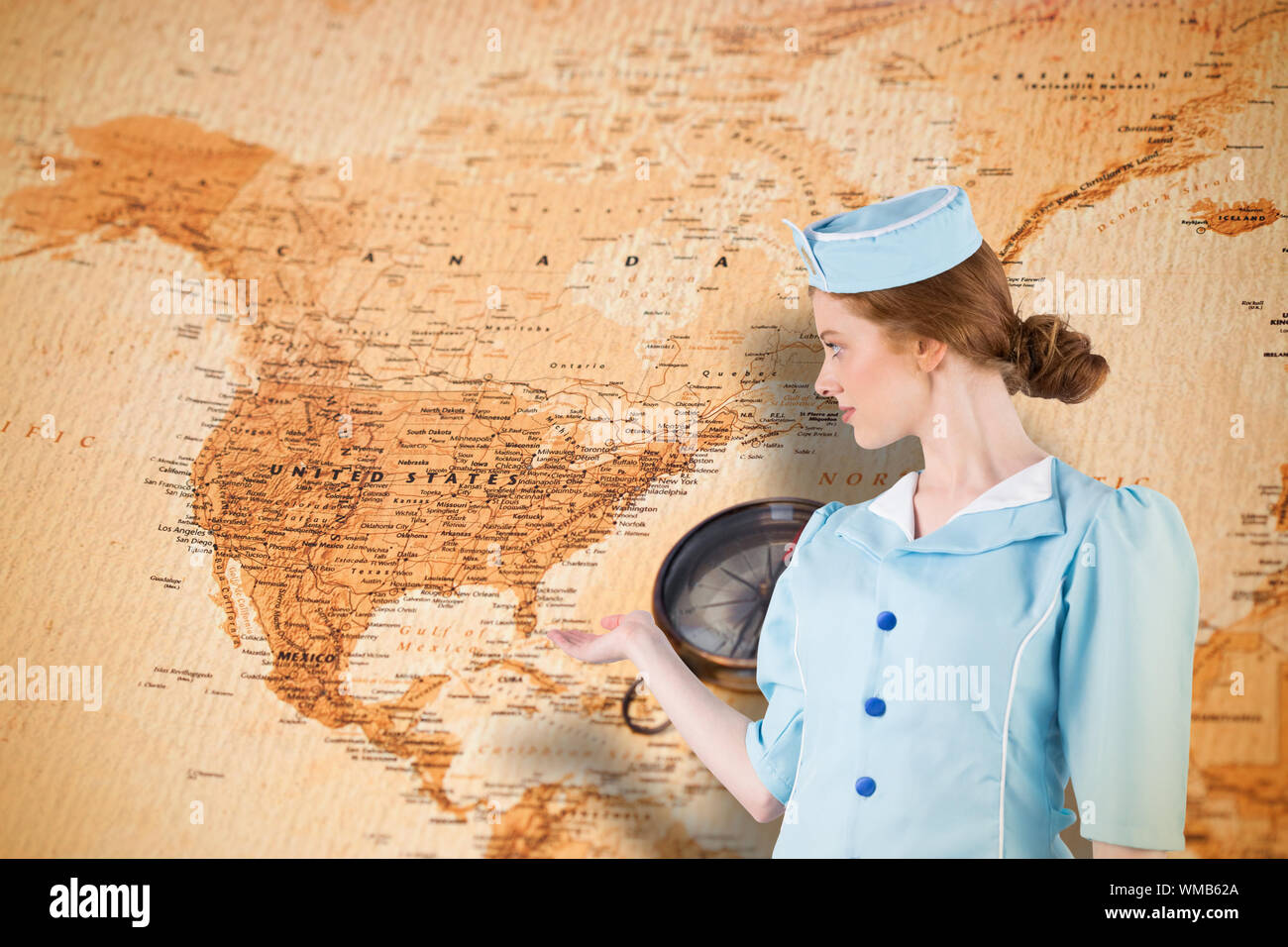 Pretty air hostess presenting with hand against world map with compass ...