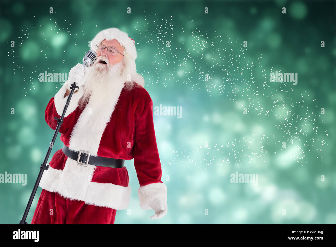 Santa sings like a Superstar against blue abstract light spot design ...