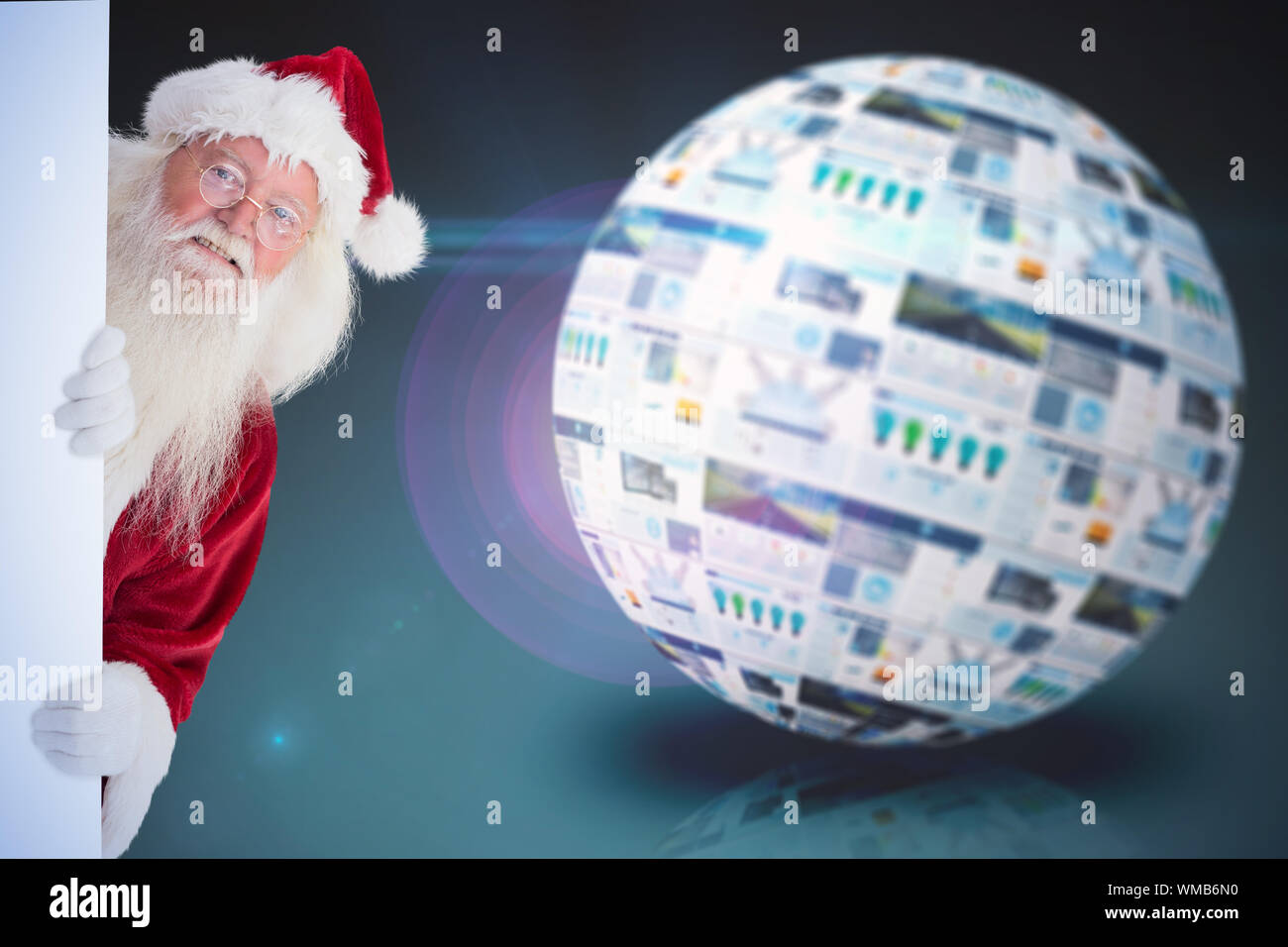 Santa looks out behind a wall against screen sphere showing business ...