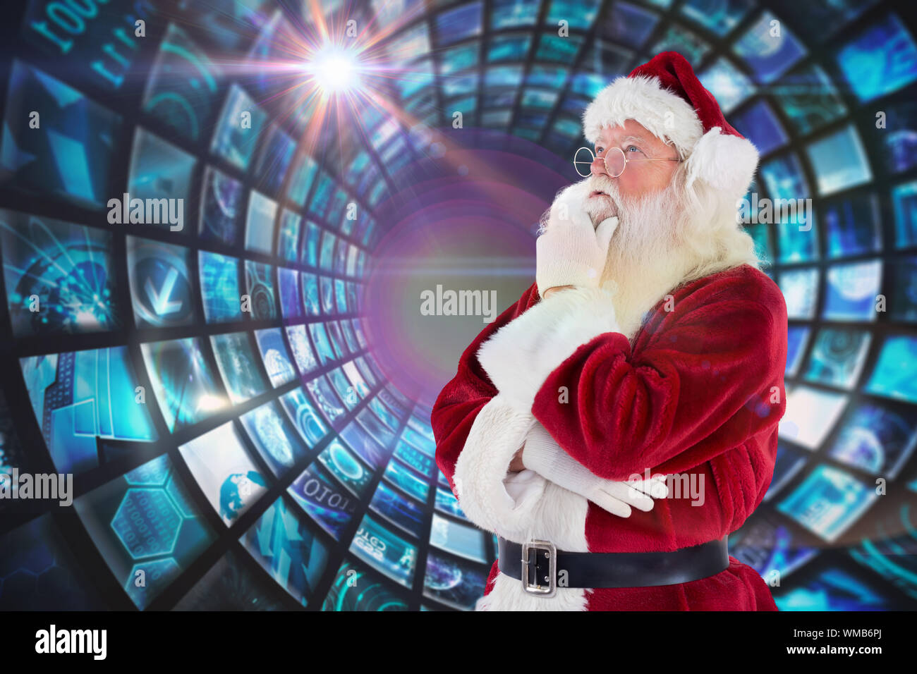 Santa is thinking about something against vortex of digital screens in ...