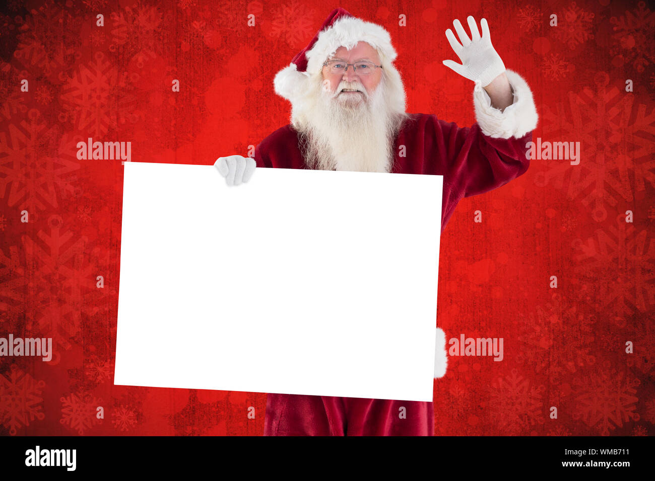 Santa holds a sign and is waving against red paint splatter background ...