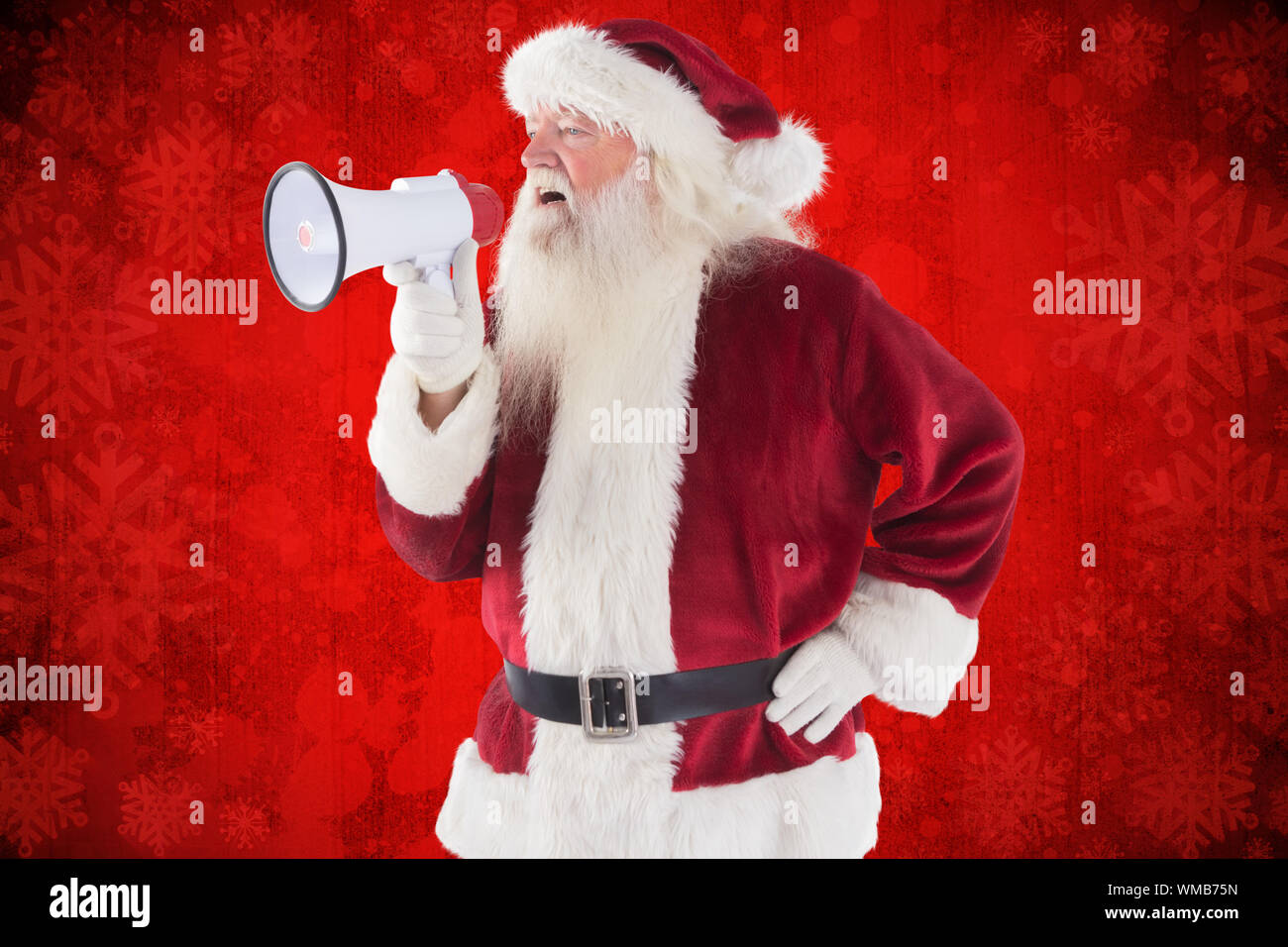Santa Claus is using a megaphone against red paint splatter background ...