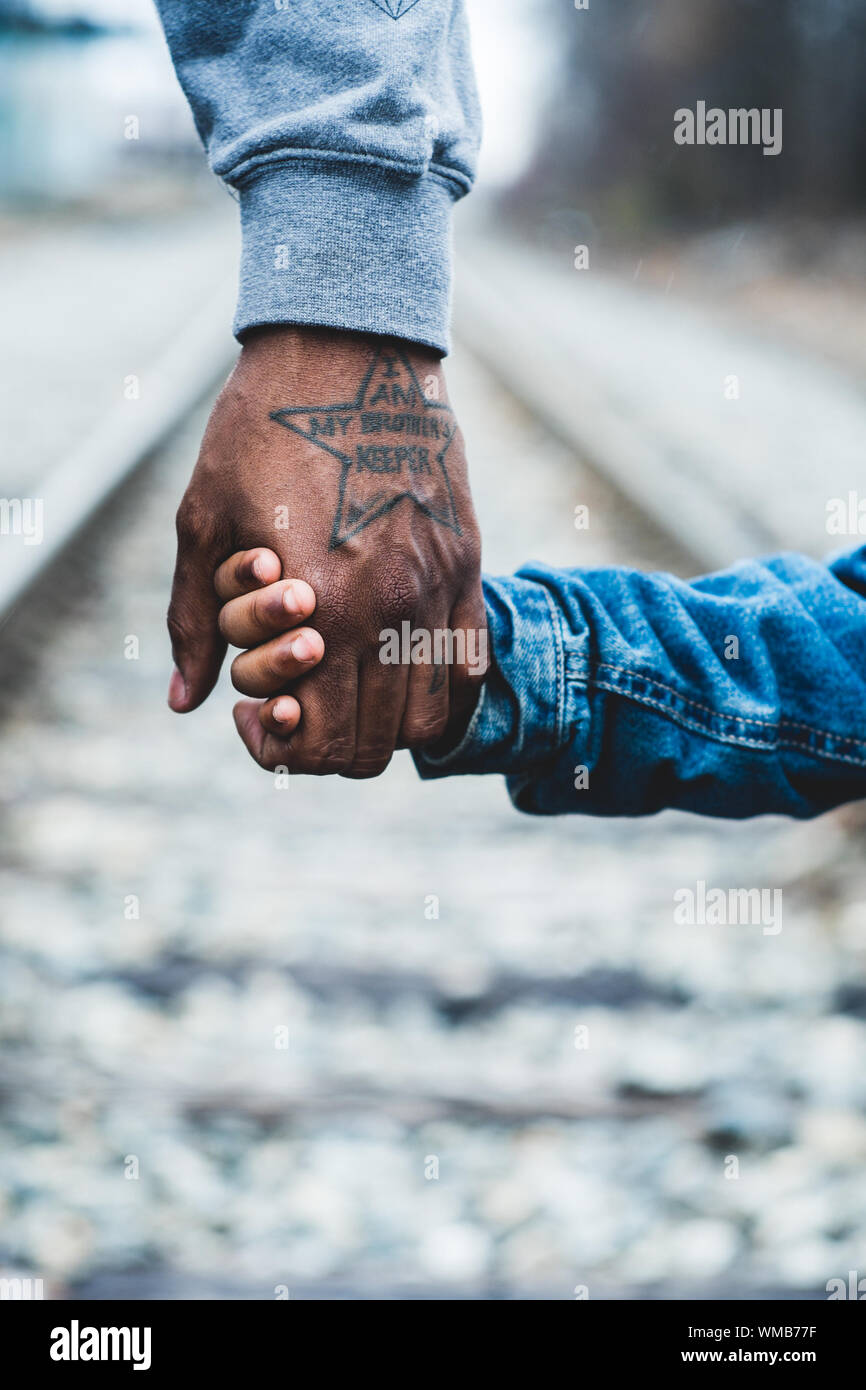 Hands holding rail hi-res stock photography and images - Alamy