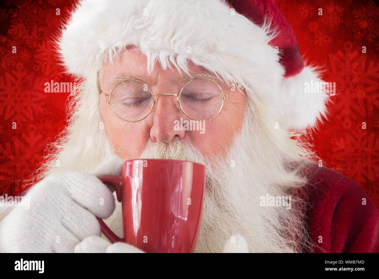 Santa drinks from a red cup against red paint splatter background Stock ...