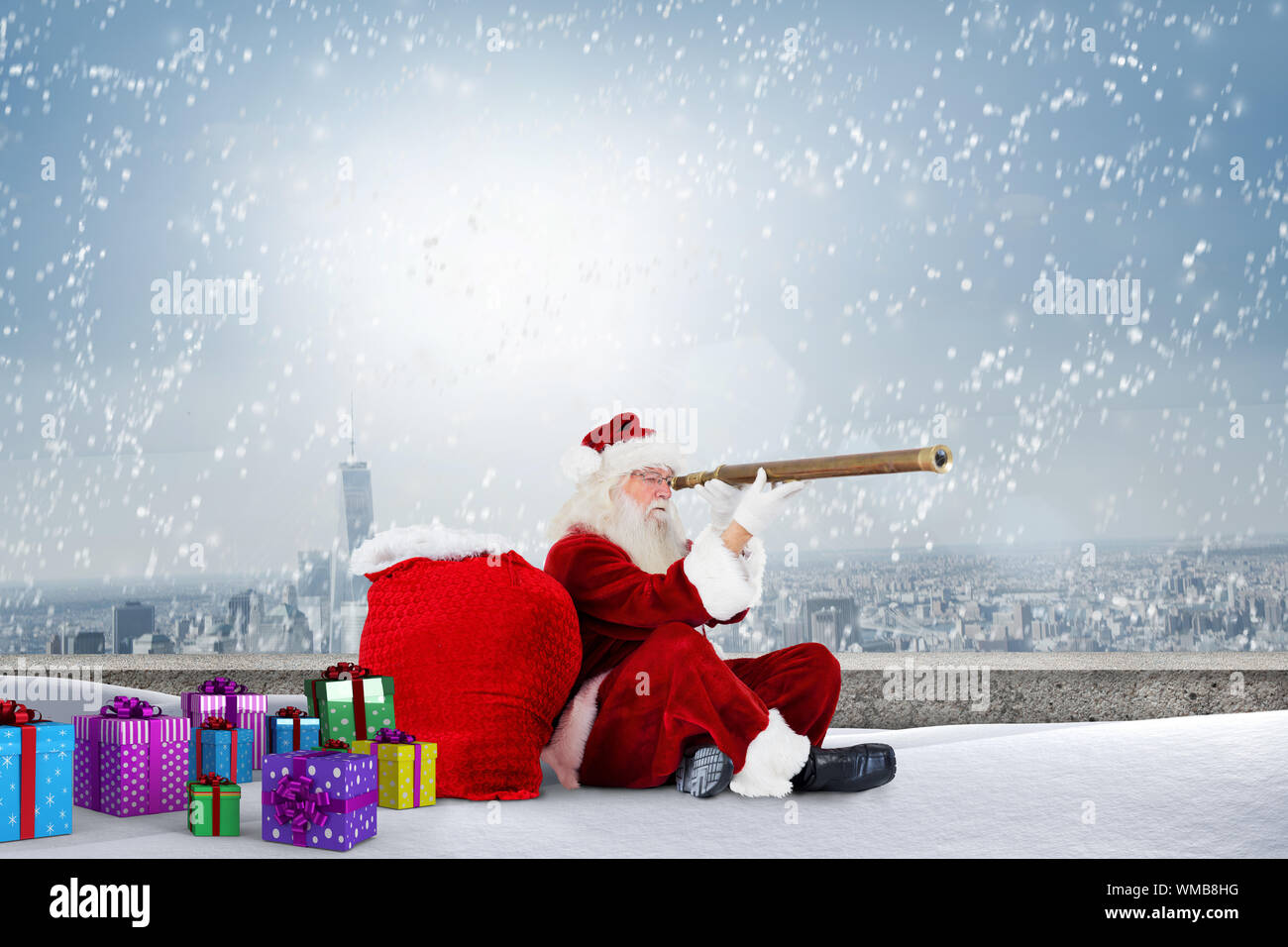 Santa looking through telescope against balcony overlooking city Stock ...