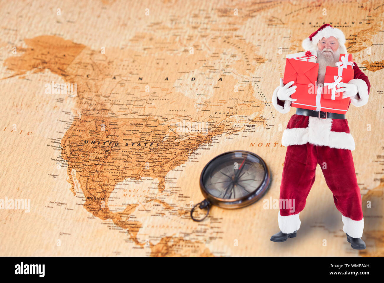 Santa carries a few presents against world map with compass showing ...