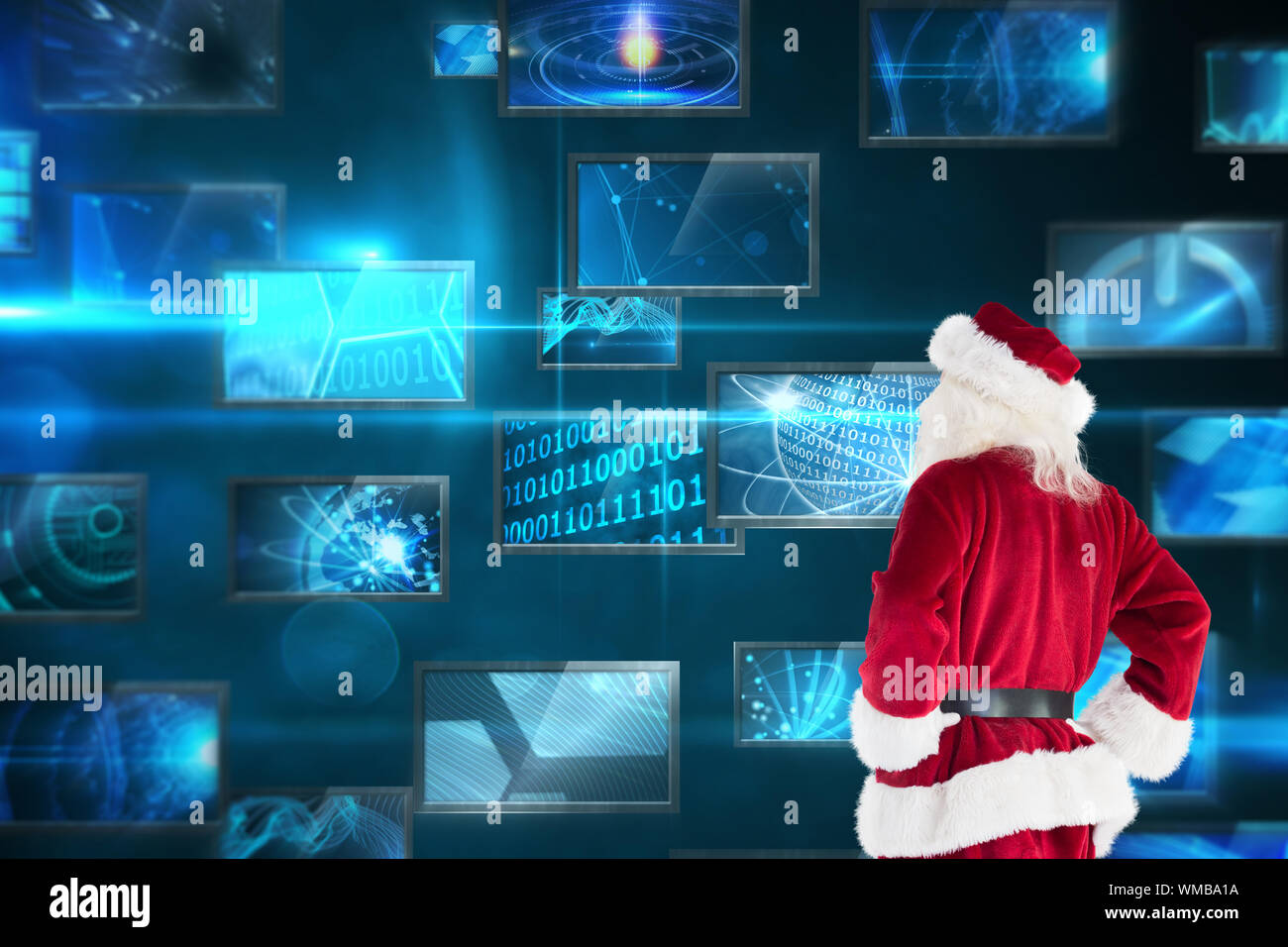 Santa looks away from the camera against screen collage showing ...