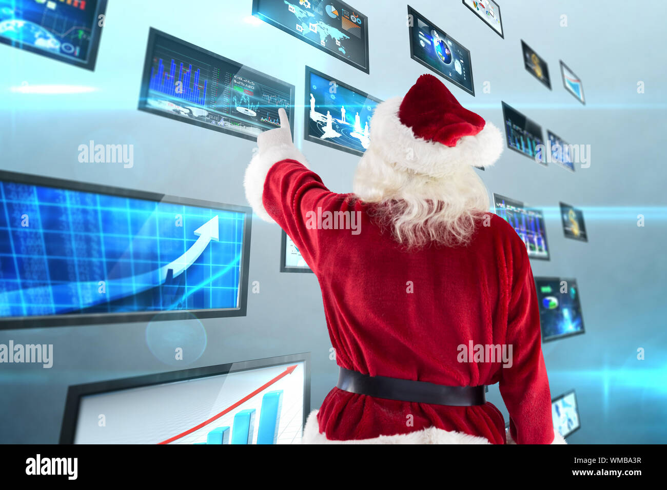 Santa Claus points at something against screen collage showing business ...