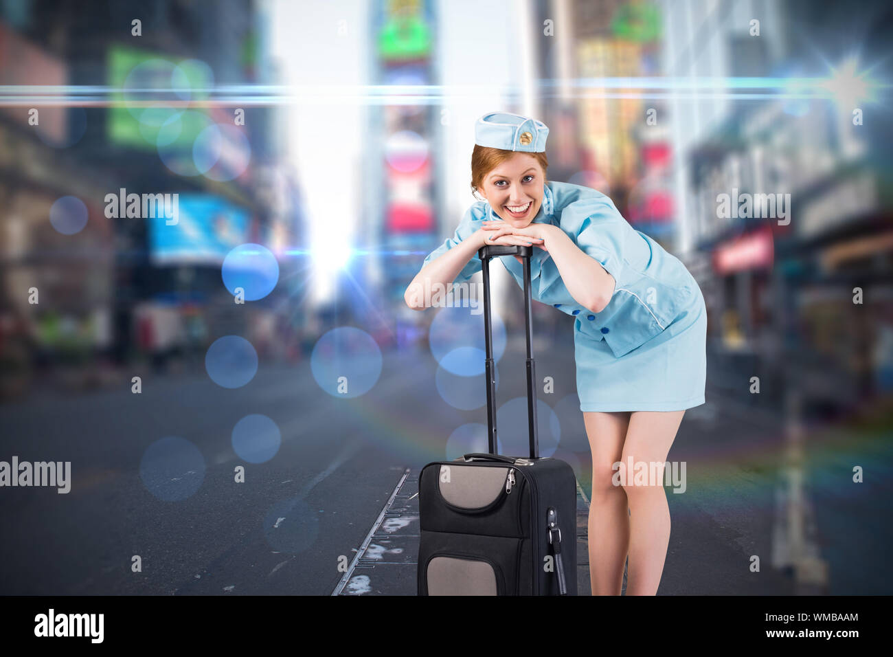 Pretty air hostess smiling at camera against blurred new york street ...