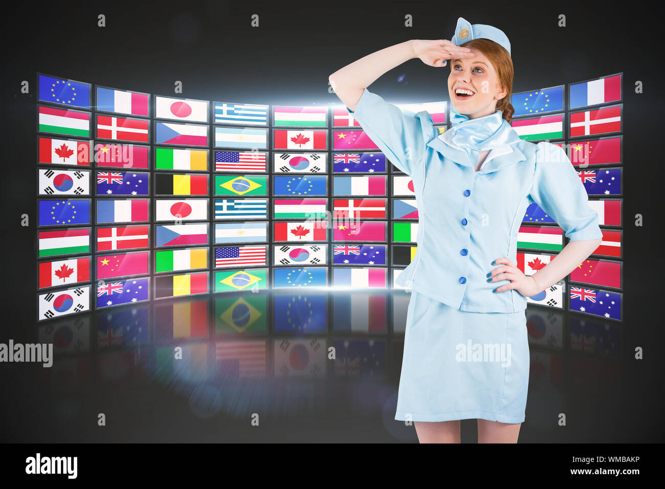 Pretty air hostess looking up against screen collage showing ...