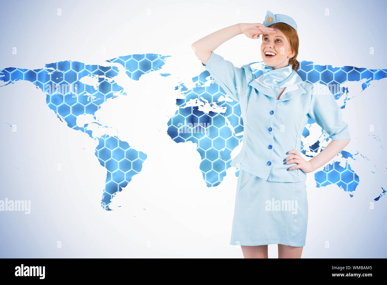 Pretty air hostess looking up against background with hexagons and ...