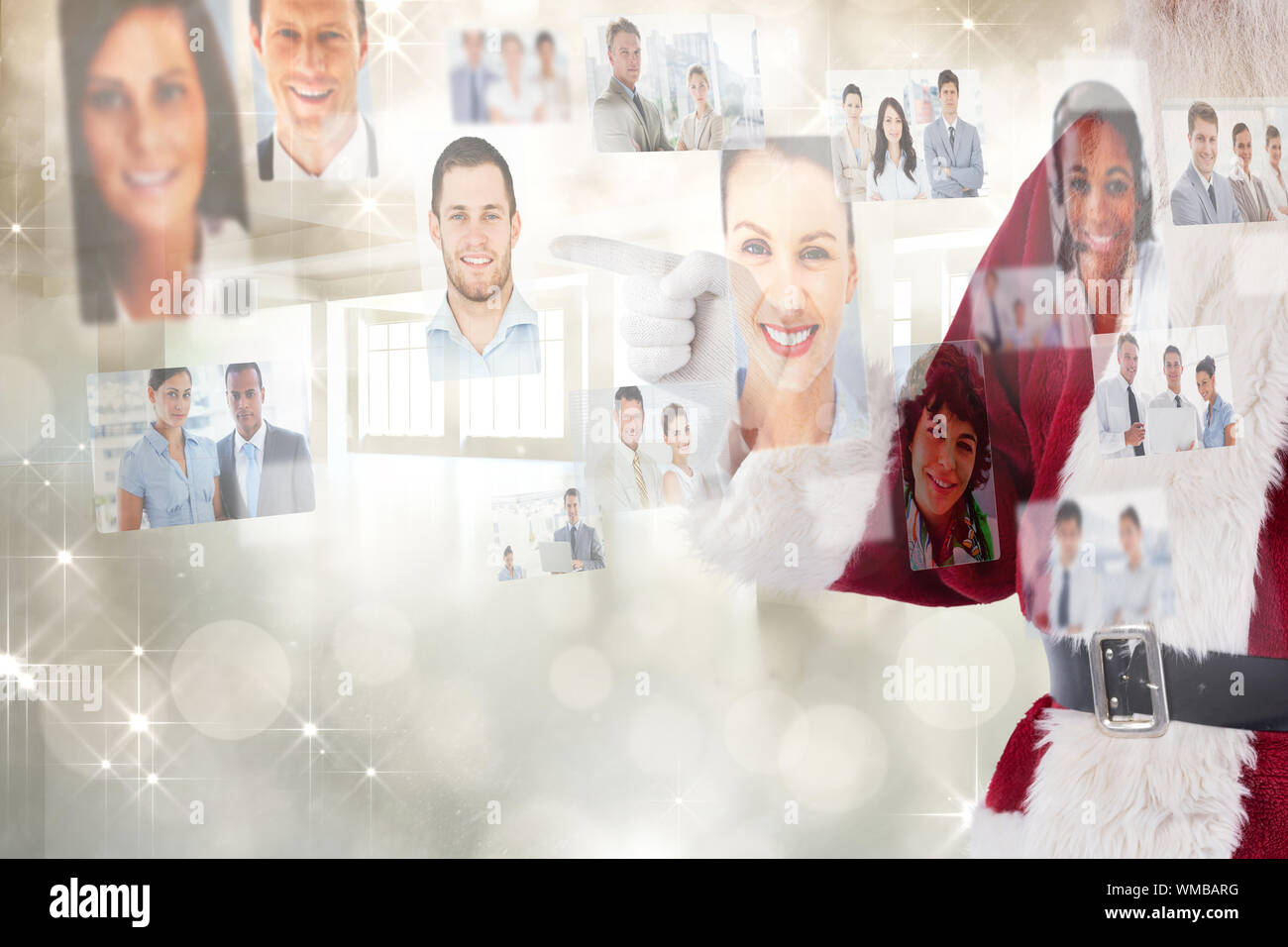 Santa Claus points at something against lights twinkling in modern room ...