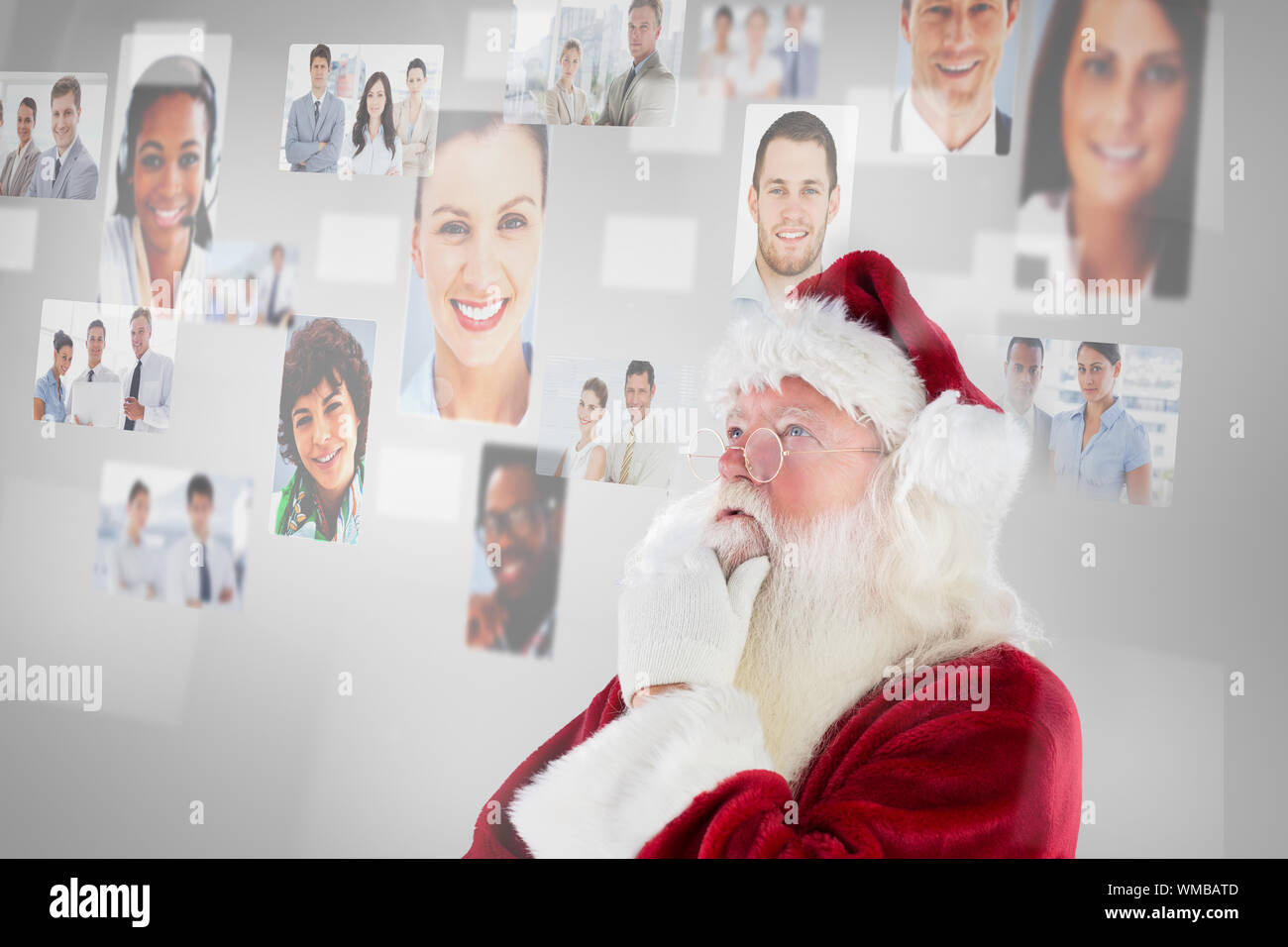 Santa is thinking about something against grey vignette Stock Photo - Alamy