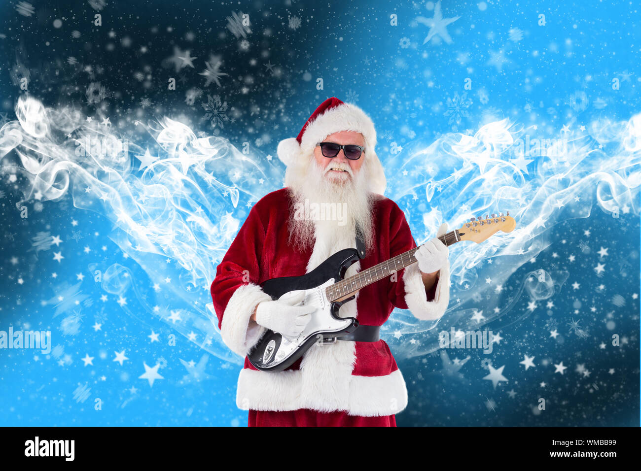 Santa Claus plays guitar with sunglasses against blue background Stock ...