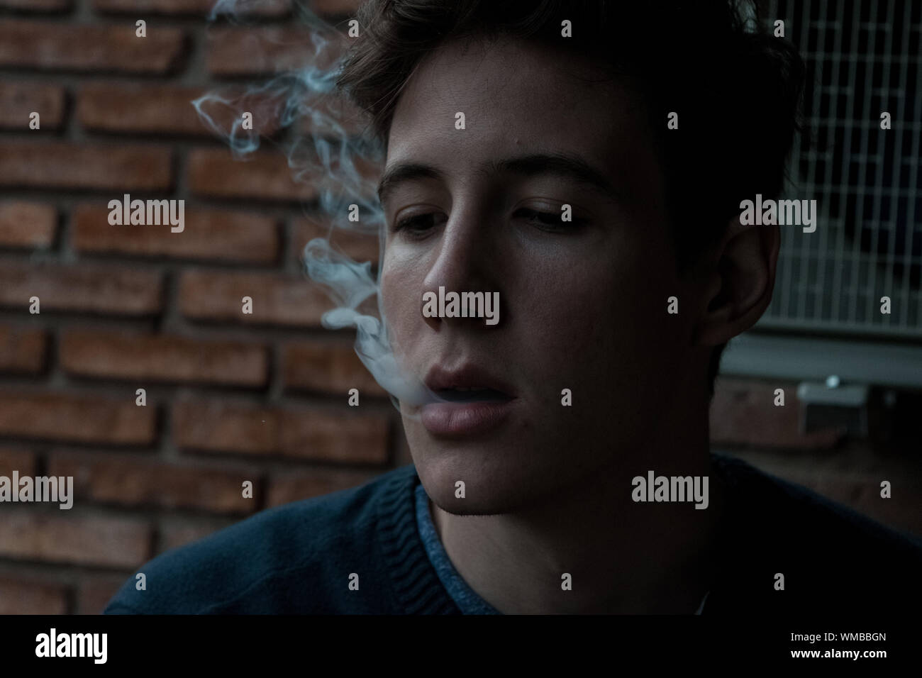 Man exhaling smoke hi-res stock photography and images - Alamy