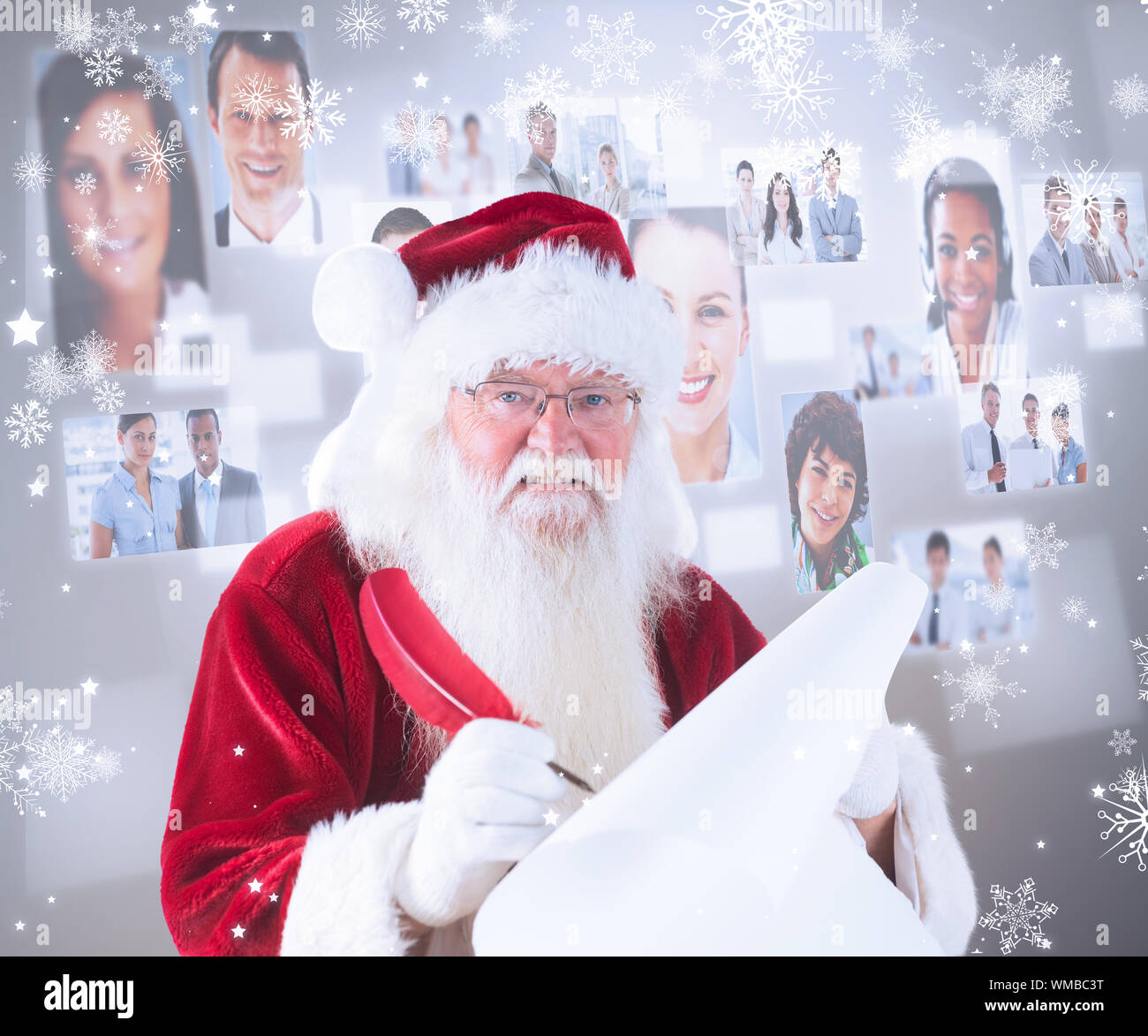 Santa claus writing on scroll against grey vignette Stock Photo - Alamy