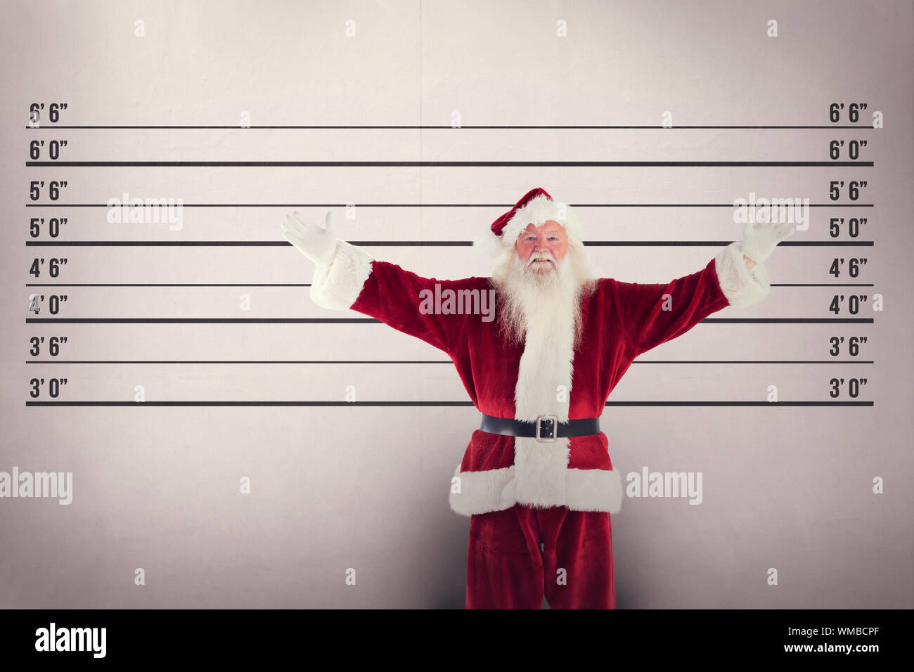 Jolly Santa opens his arms to camera against mug shot background Stock ...