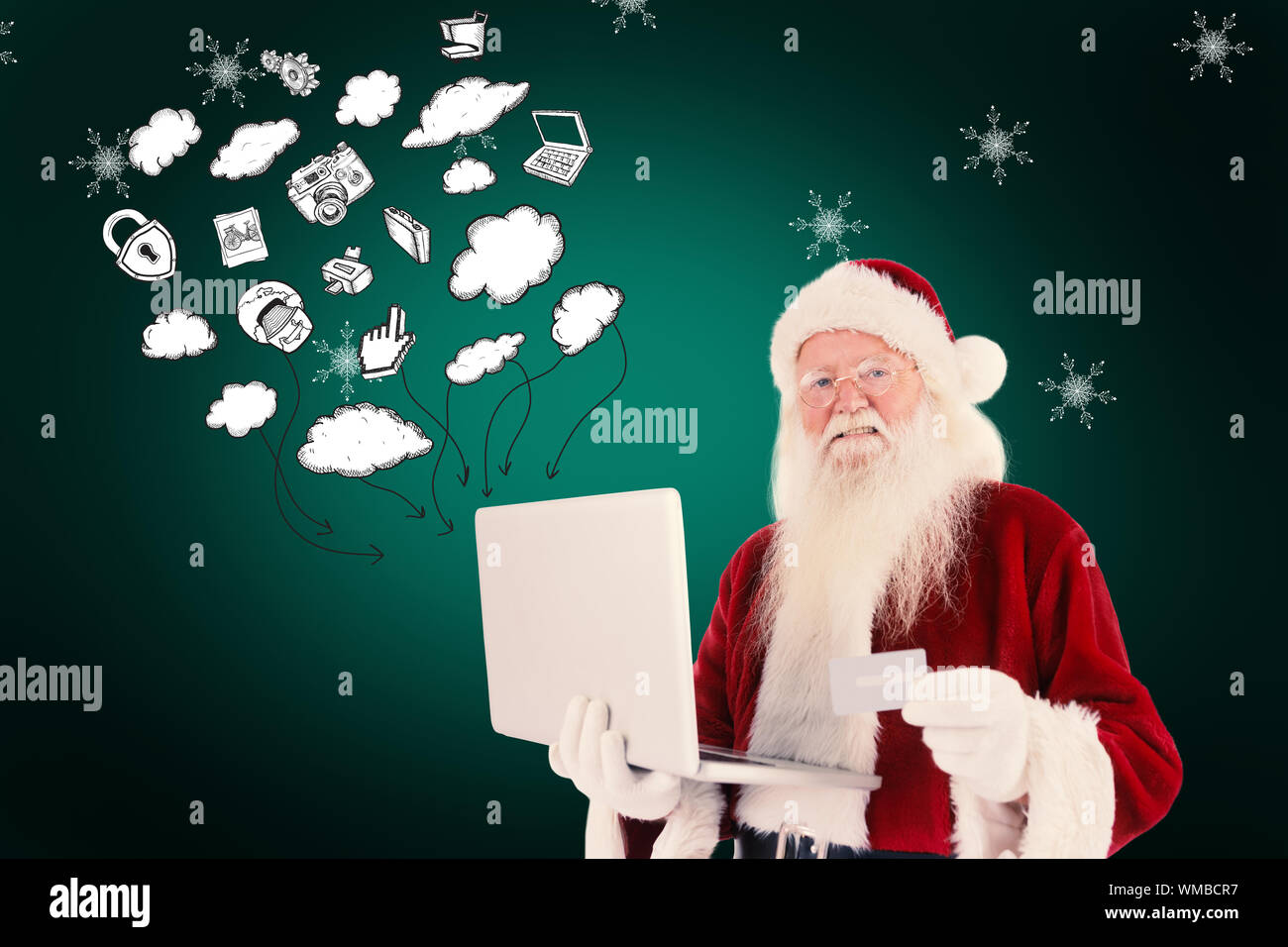 Santa pays with credit card on a laptop against green background with ...