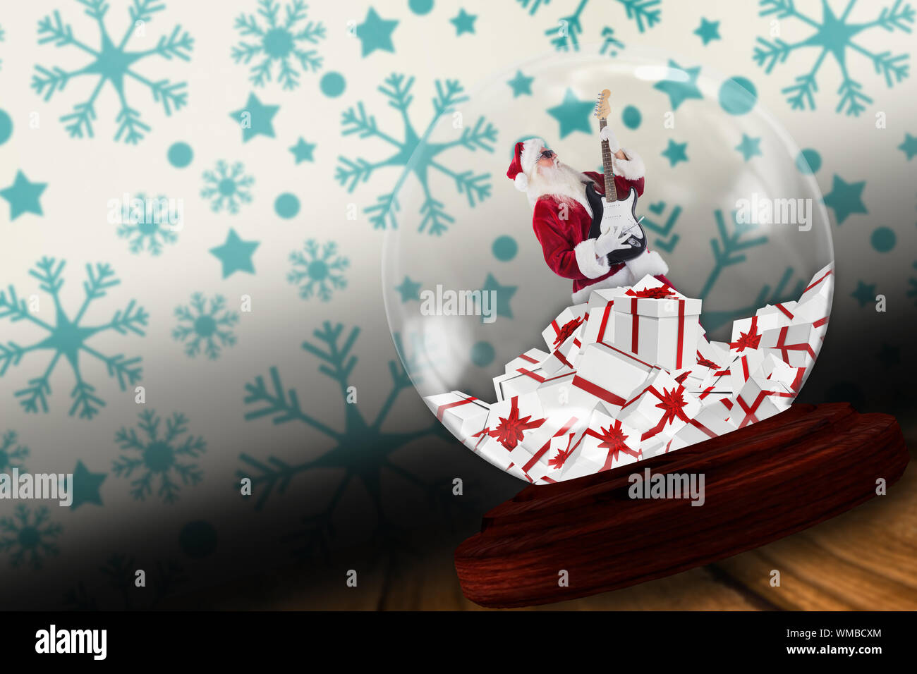 Santa rocking out in snow globe against snowflake wallpaper over floor ...
