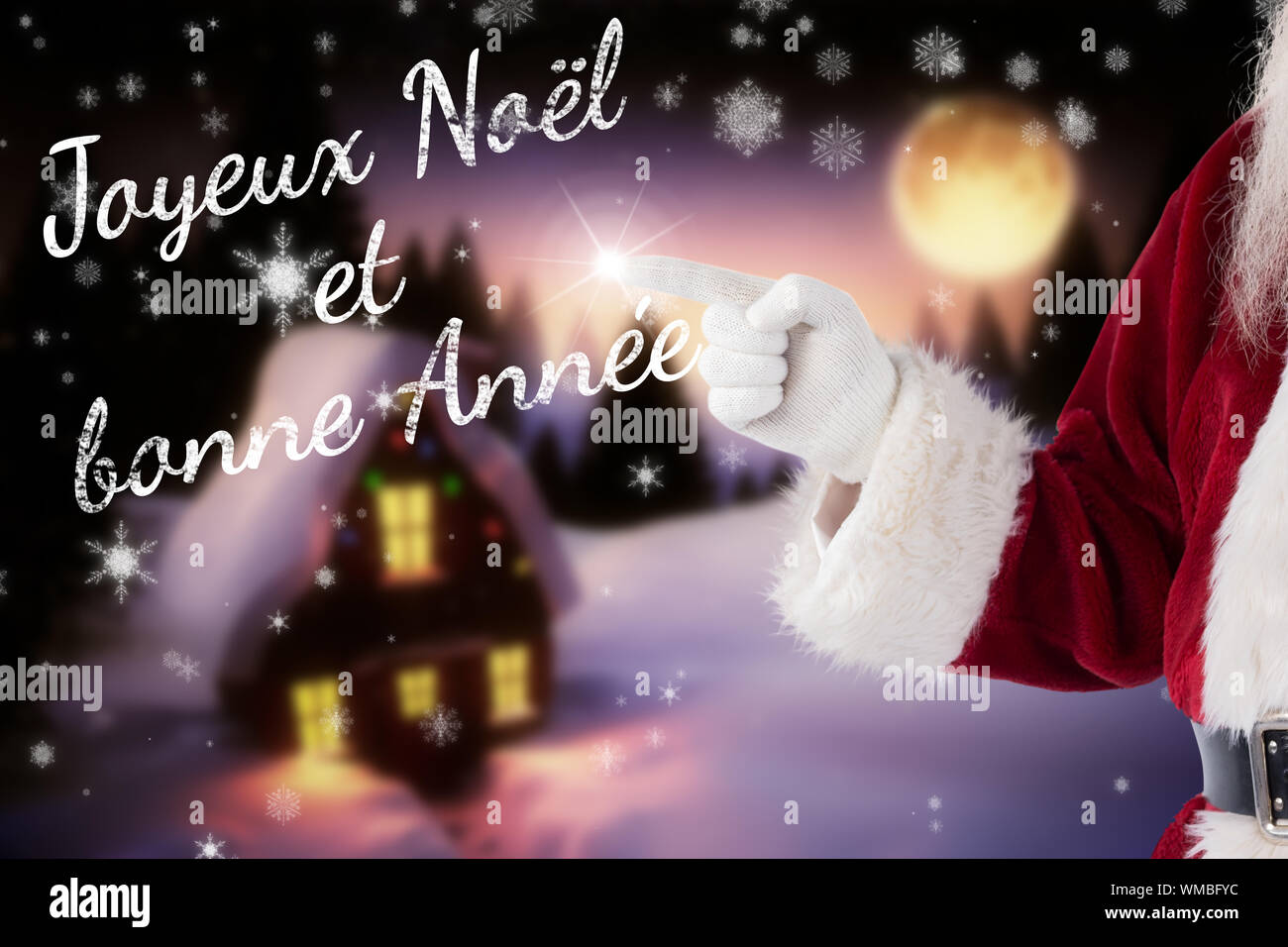 Santa claus points at something against snow falling Stock Photo - Alamy